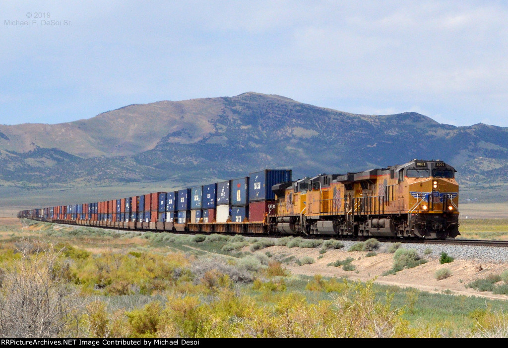 UP #8001, 6269, 8650 (ES-44AC, AC-4400CW, SD-70ACE) lead an eastbound stack train as it ...